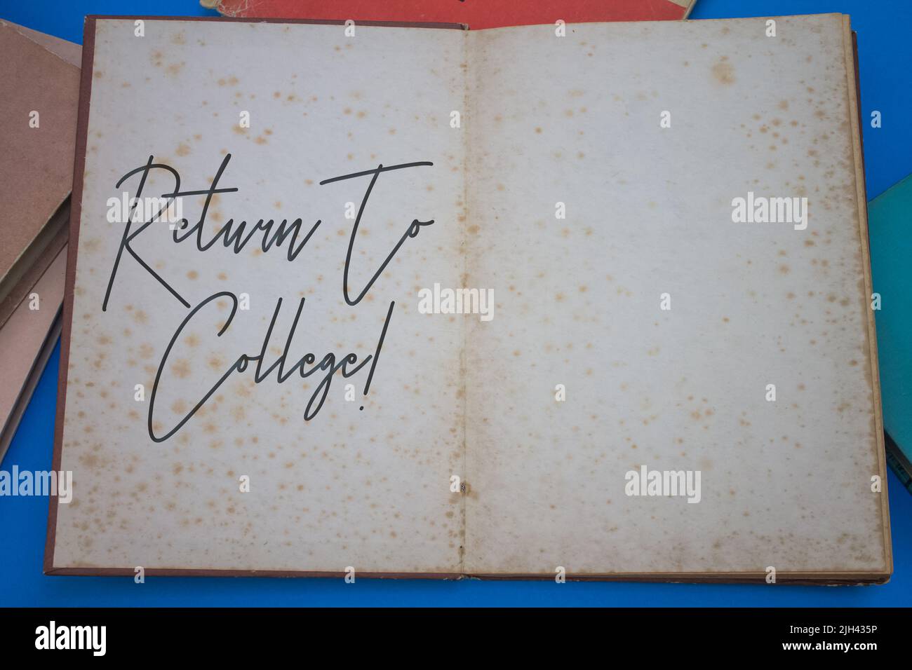 Return To College word in opened book with vintage, natural patterns ...