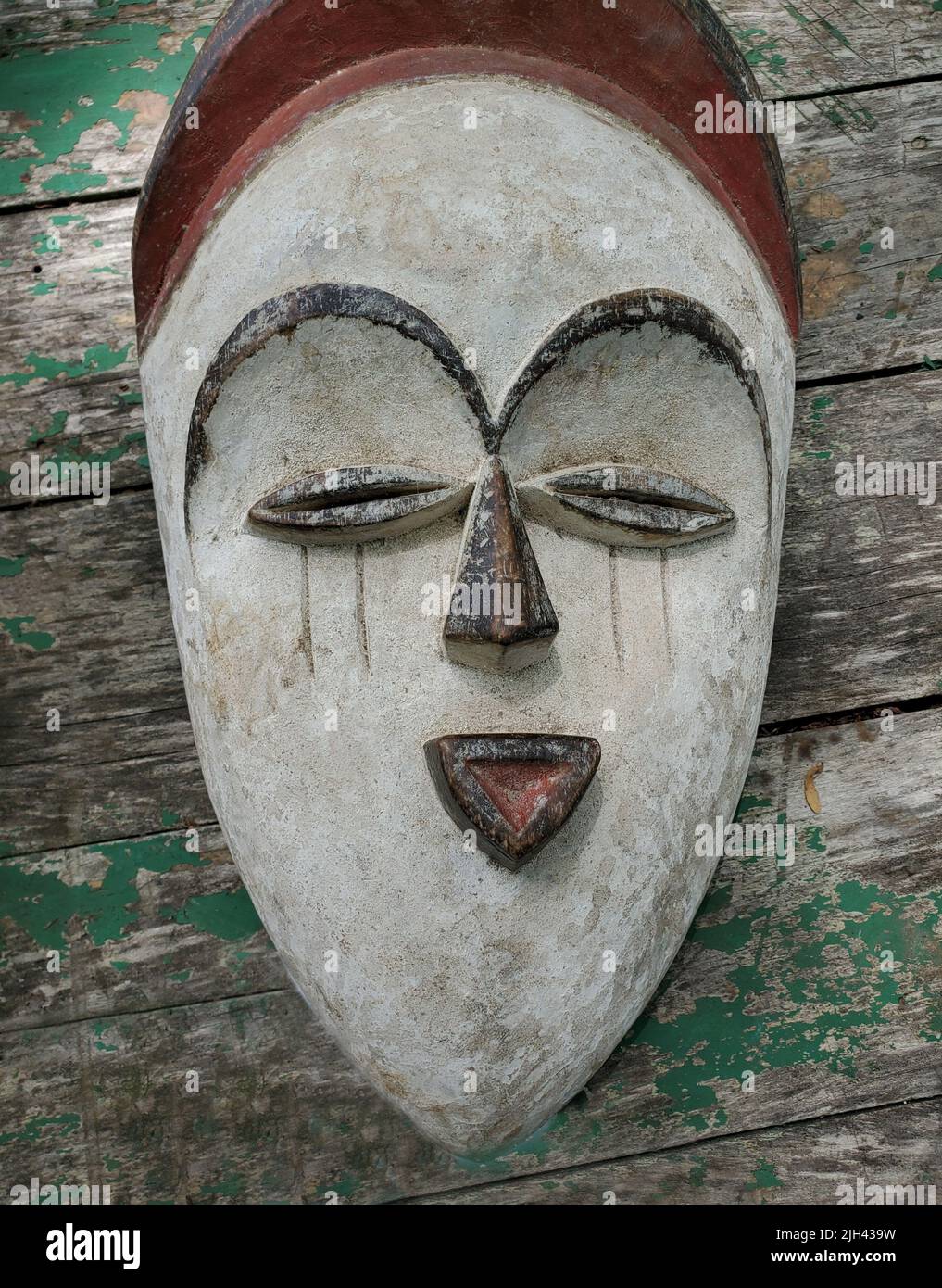 carved wooden mask from africa with arched eye brows and a smile Stock ...