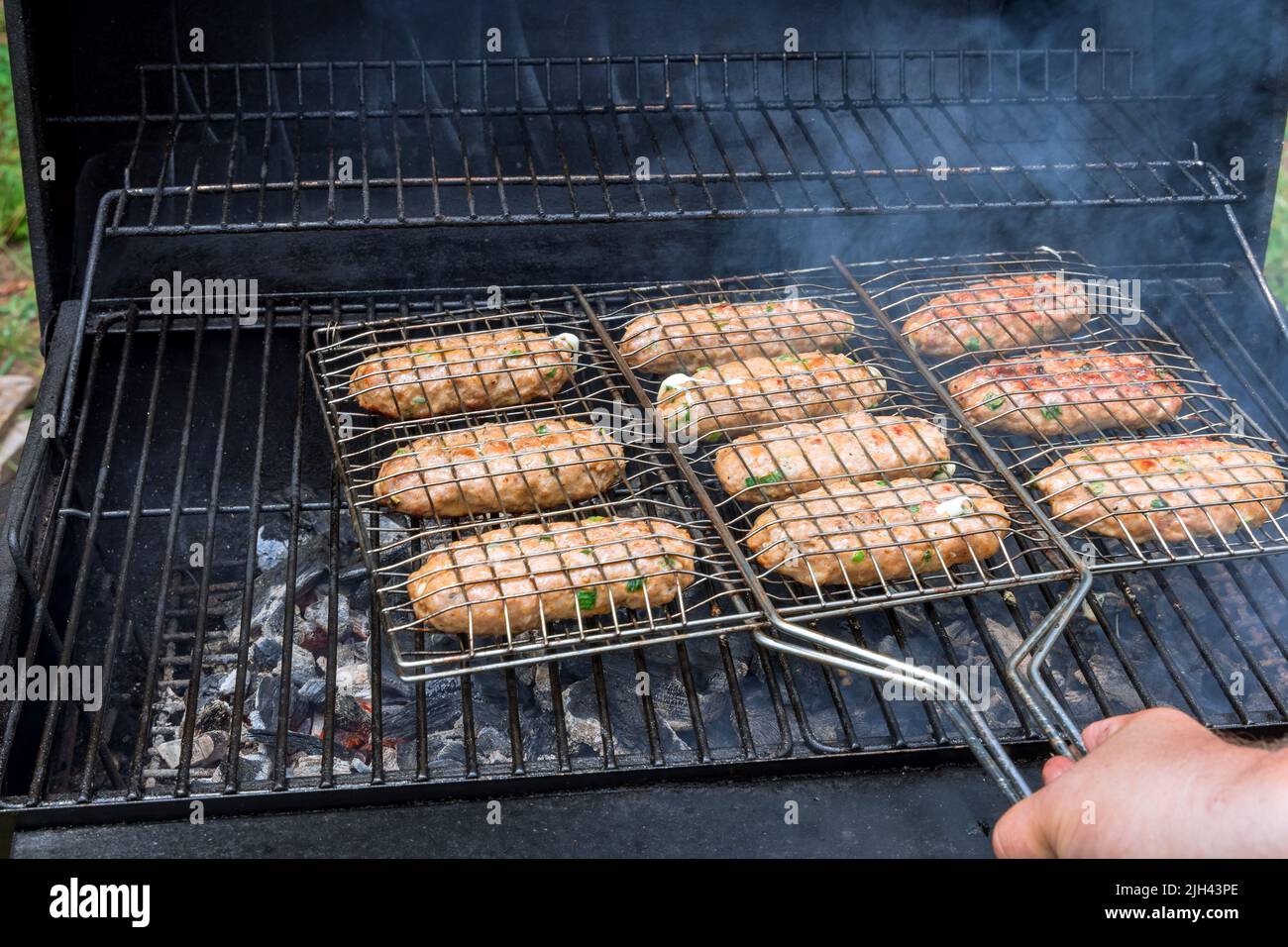 Served on a hot grill with American barbecue foods including burgers ...