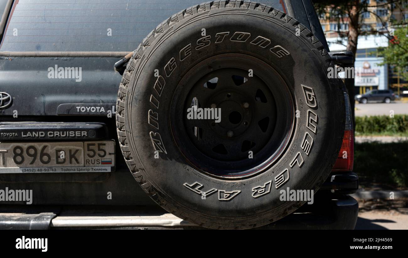 Spare wheel on back of Land Cruiser 4x4 off-road vehicle, bridgestone ...