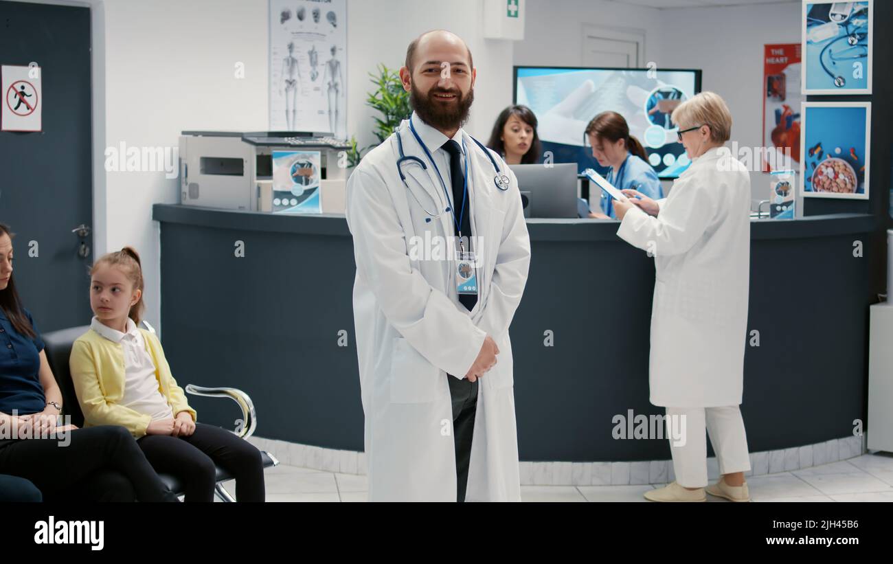 Portrait of general practitioner with stethoscope and uniform posing in ...