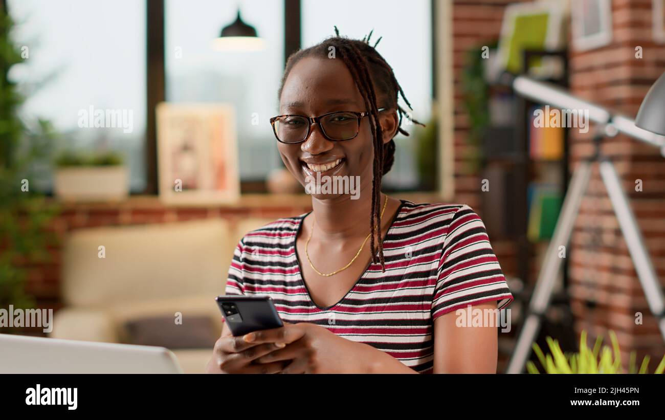 Portrait of businesswoman texting messages on mobile phone, using ...