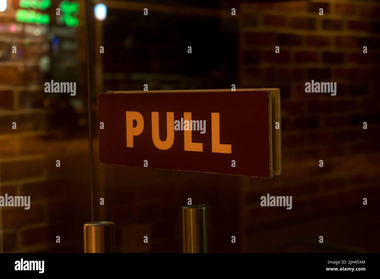 Pull sign board on a glass door Stock Photo - Alamy