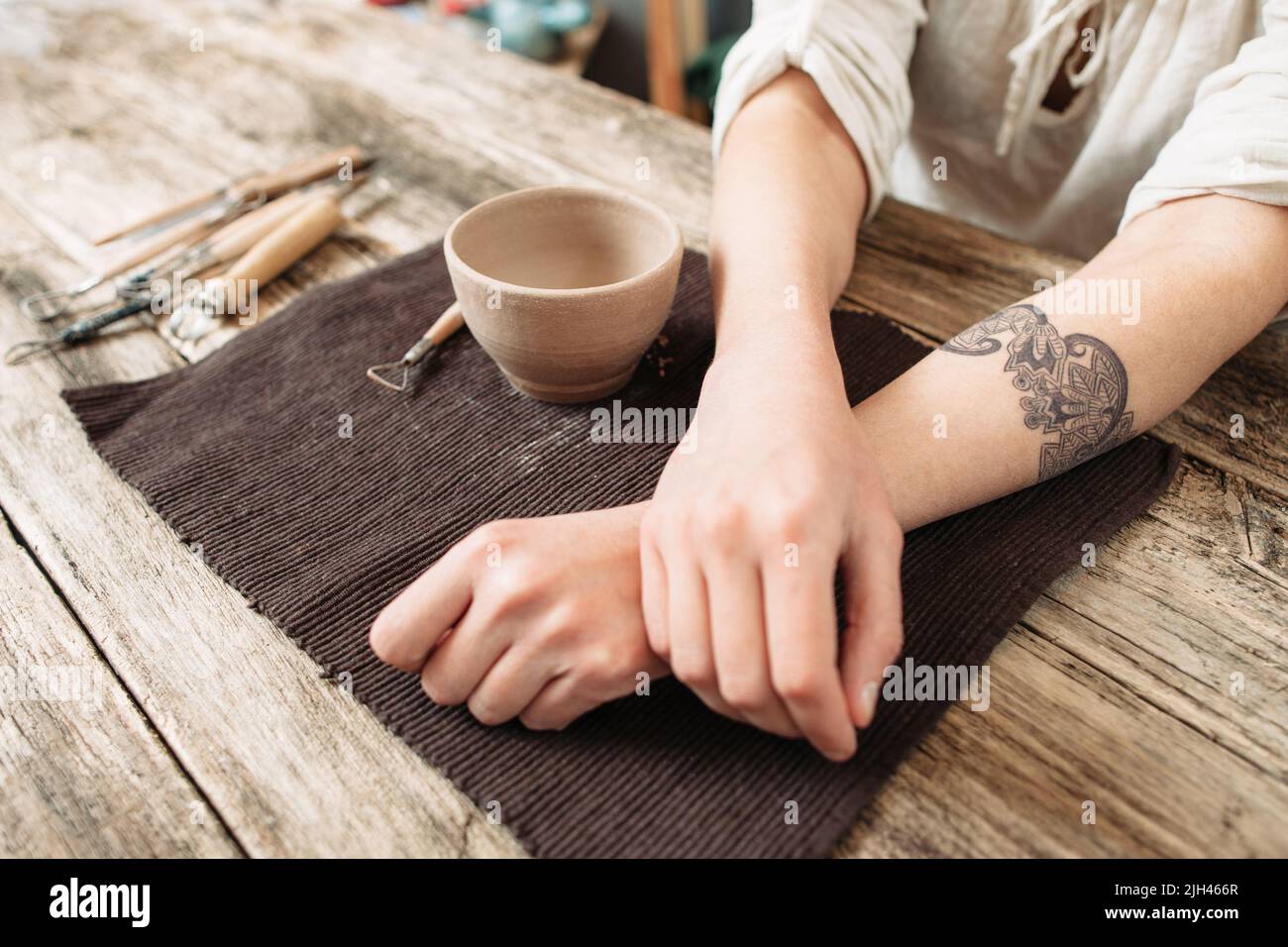 Tired hands of craftsman, rest after work Stock Photo - Alamy