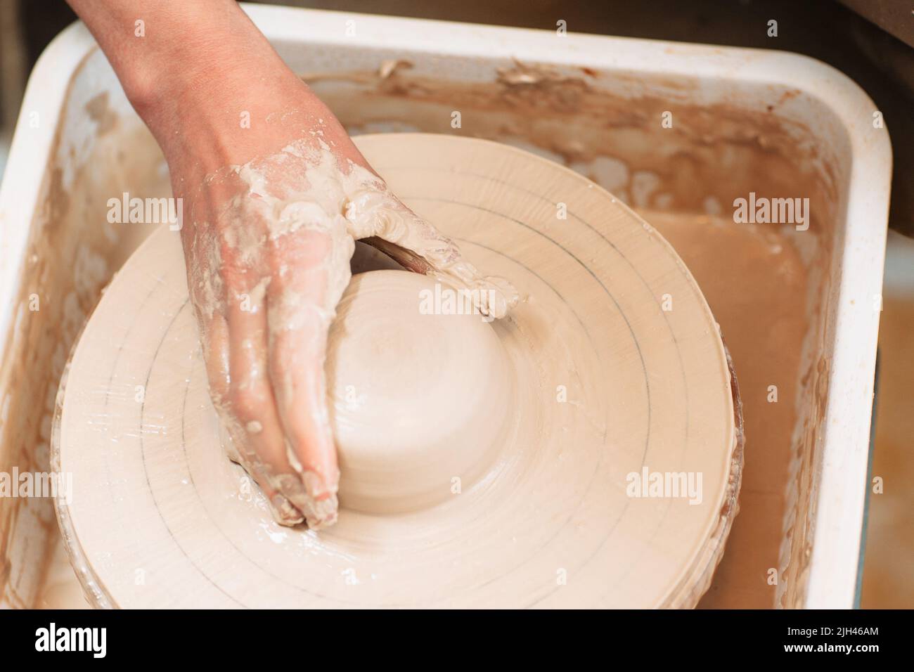 Clay on pottery wheel flat lay Stock Photo - Alamy