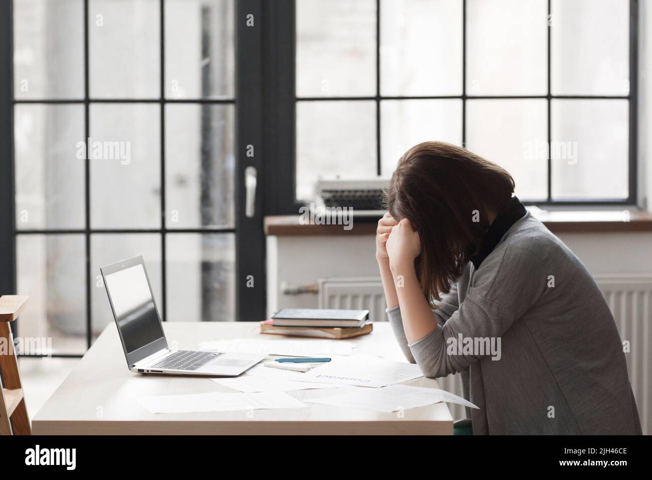 Tired business woman at workplace in office Stock Photo - Alamy