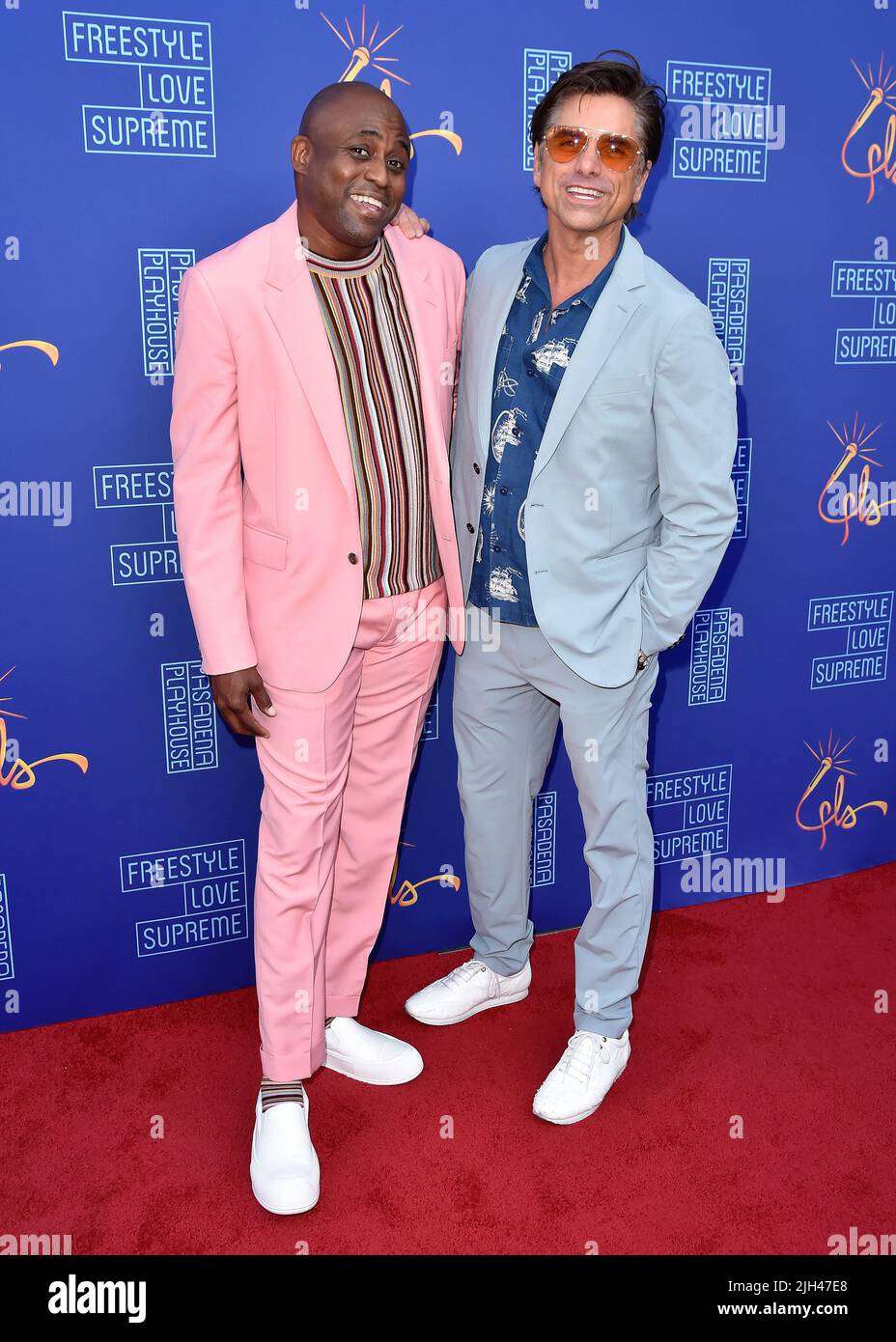 Wayne Brady and John Stamos walking on the red carpet at the opening ...