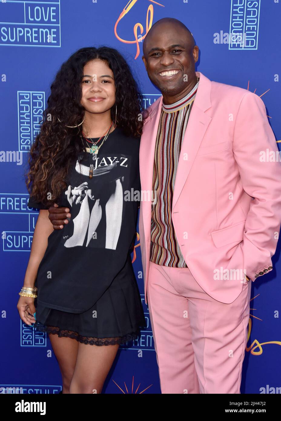 Maile Masako Brady and Wayne Brady walking on the red carpet at the ...
