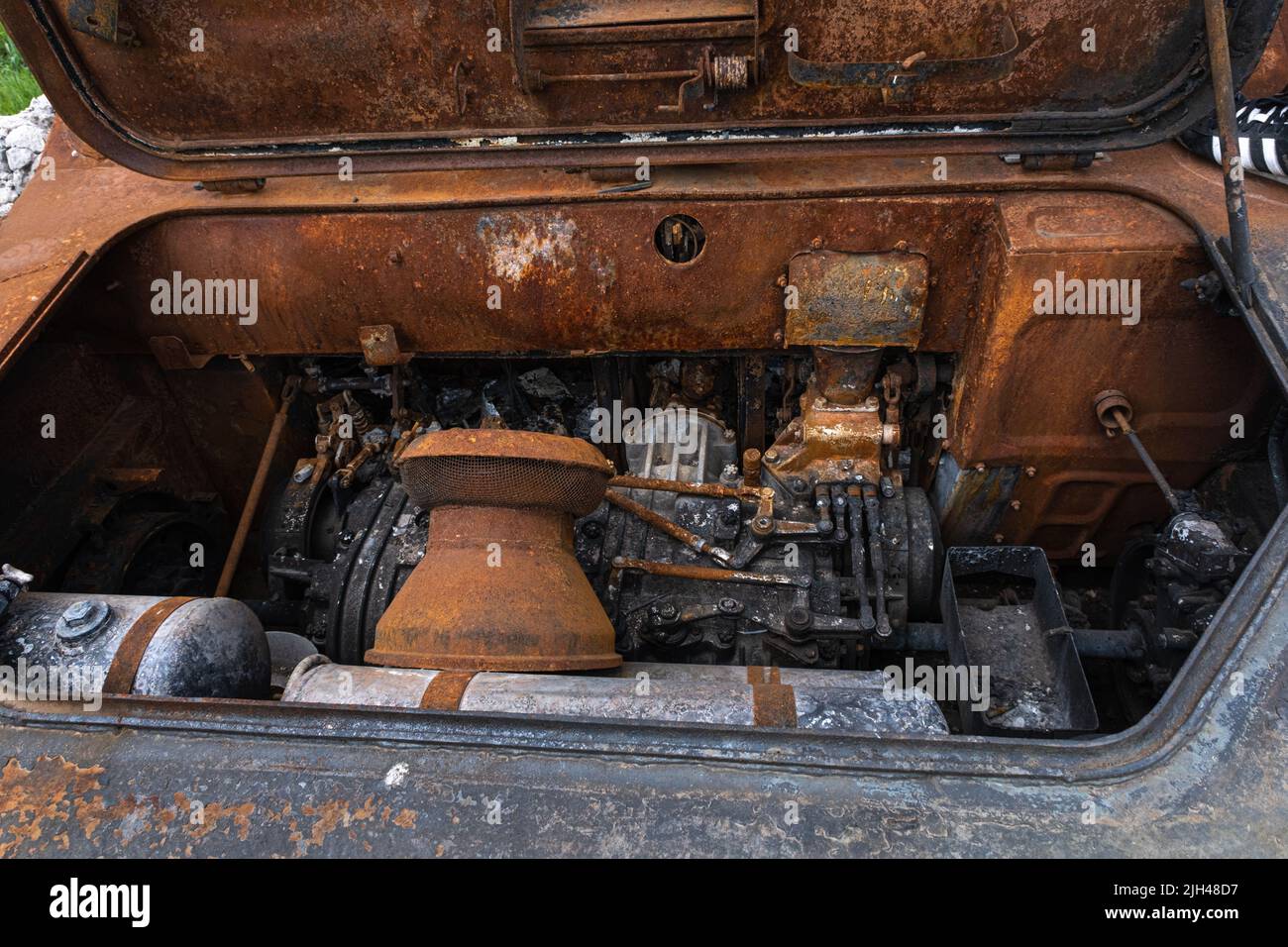 A burnt Russian tank near a residential building. War in Ukraine 2022 ...