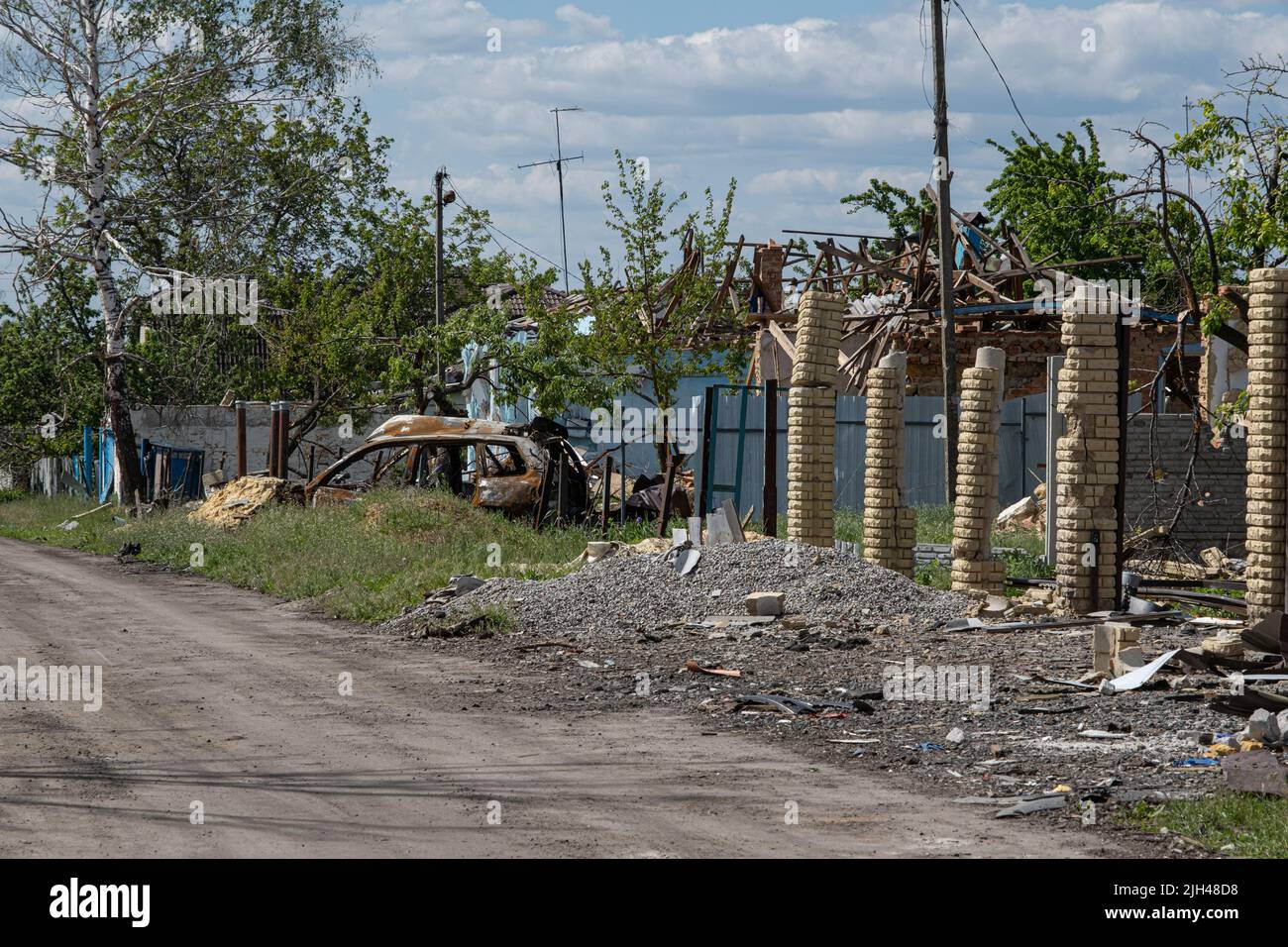 Burned and broken house and car in Kharkiv countryside. War in Ukraine ...