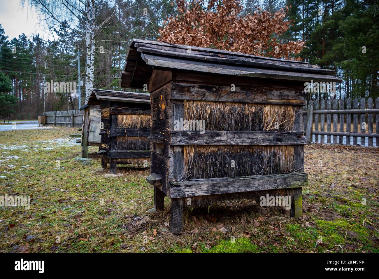 Old hives on display in the open-air museum of folk culture. The photo ...