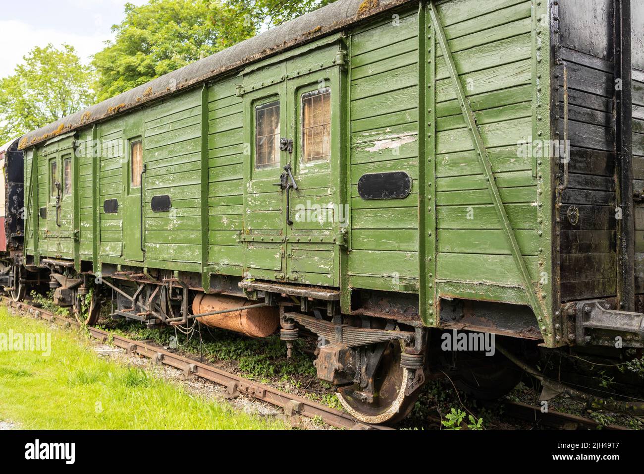 old abandoned train green wooden carriage Stock Photo - Alamy