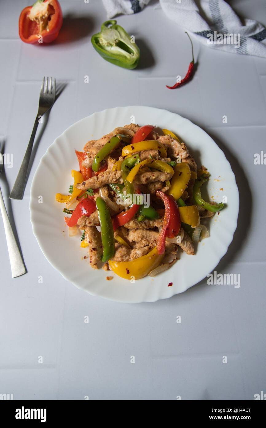 Ready to eat saute chicken and veggies in plate. Top view Stock Photo ...