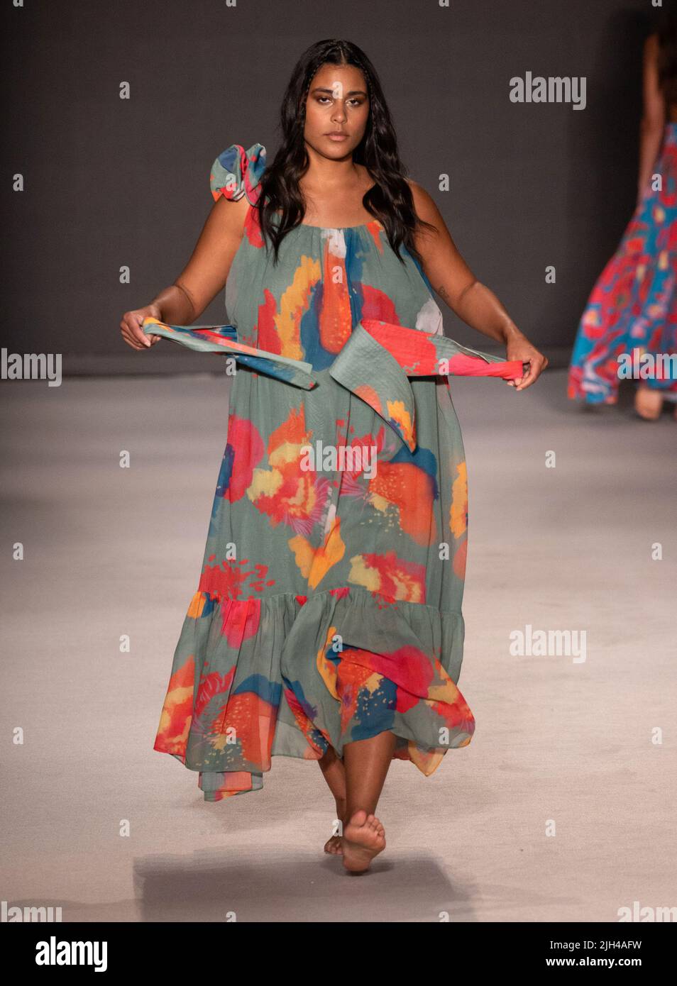 MIAMI BEACH, FLORIDA - JULY 14: A model walks the runway for Praia at ...