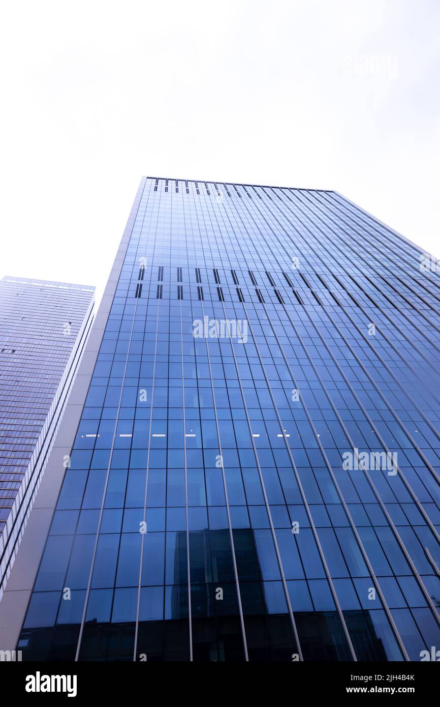 A ground perspective of some high rise buildings in the middle of a ...