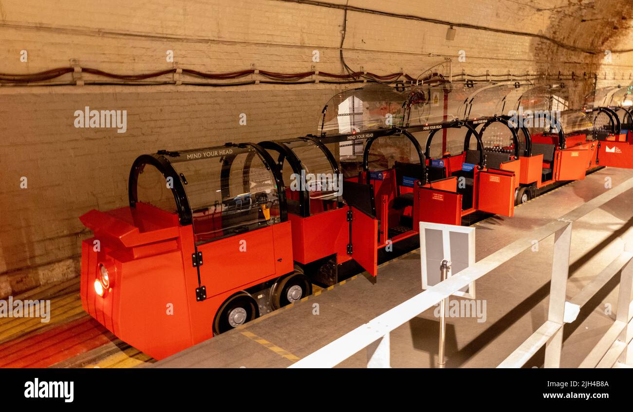 A small train used for taking mail to and from destinations in the ...