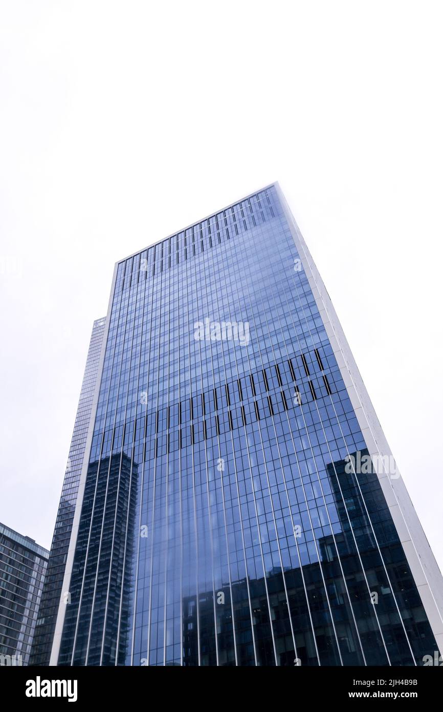 A ground perspective of some high rise buildings in the middle of a ...