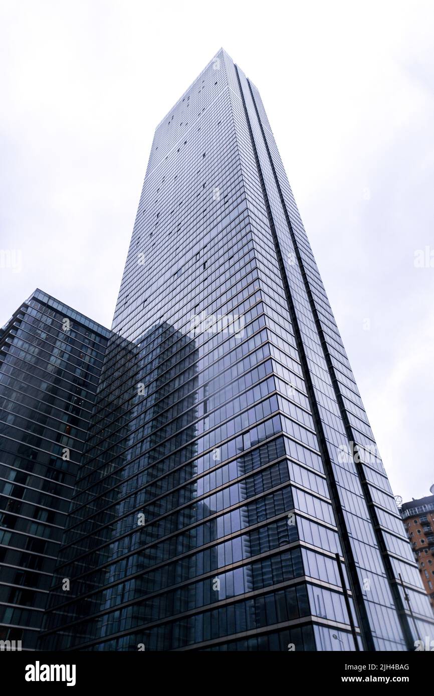 A ground perspective of some high rise buildings in the middle of a ...