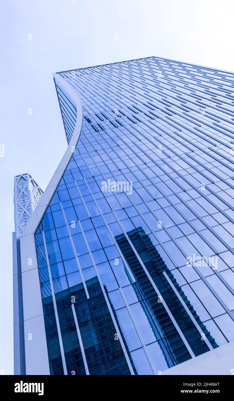 A ground perspective of some high rise buildings in the middle of a ...