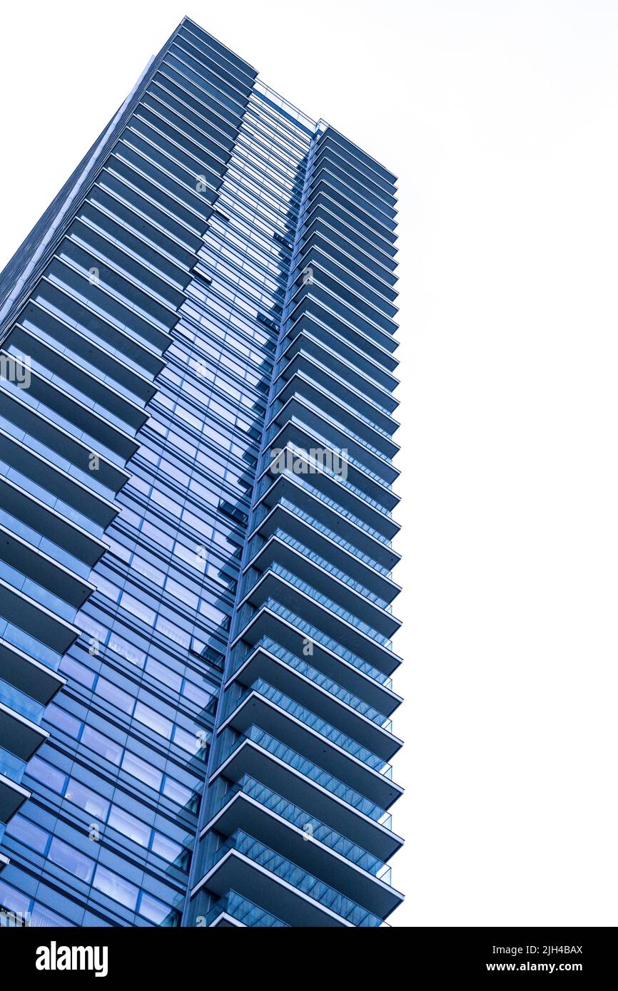 A ground perspective of some high rise buildings in the middle of a ...