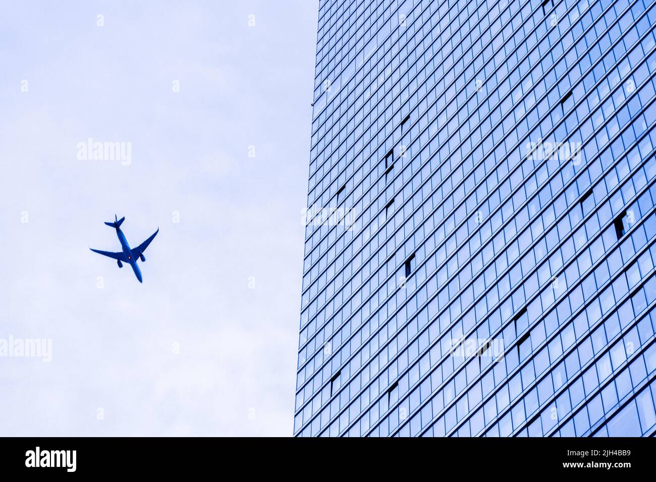 A ground perspective of some high rise buildings in the middle of a ...