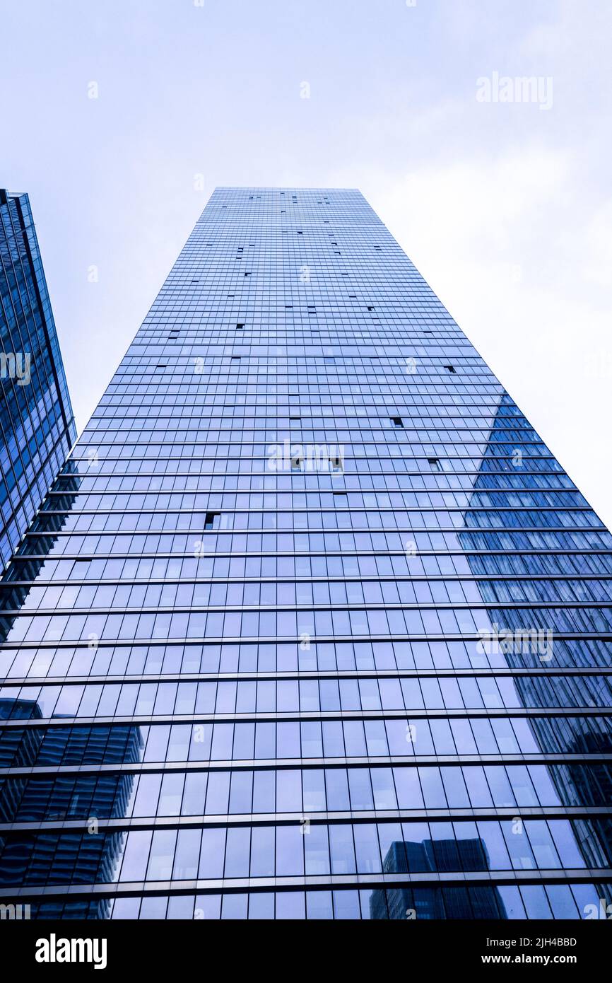 A ground perspective of some high rise buildings in the middle of a ...