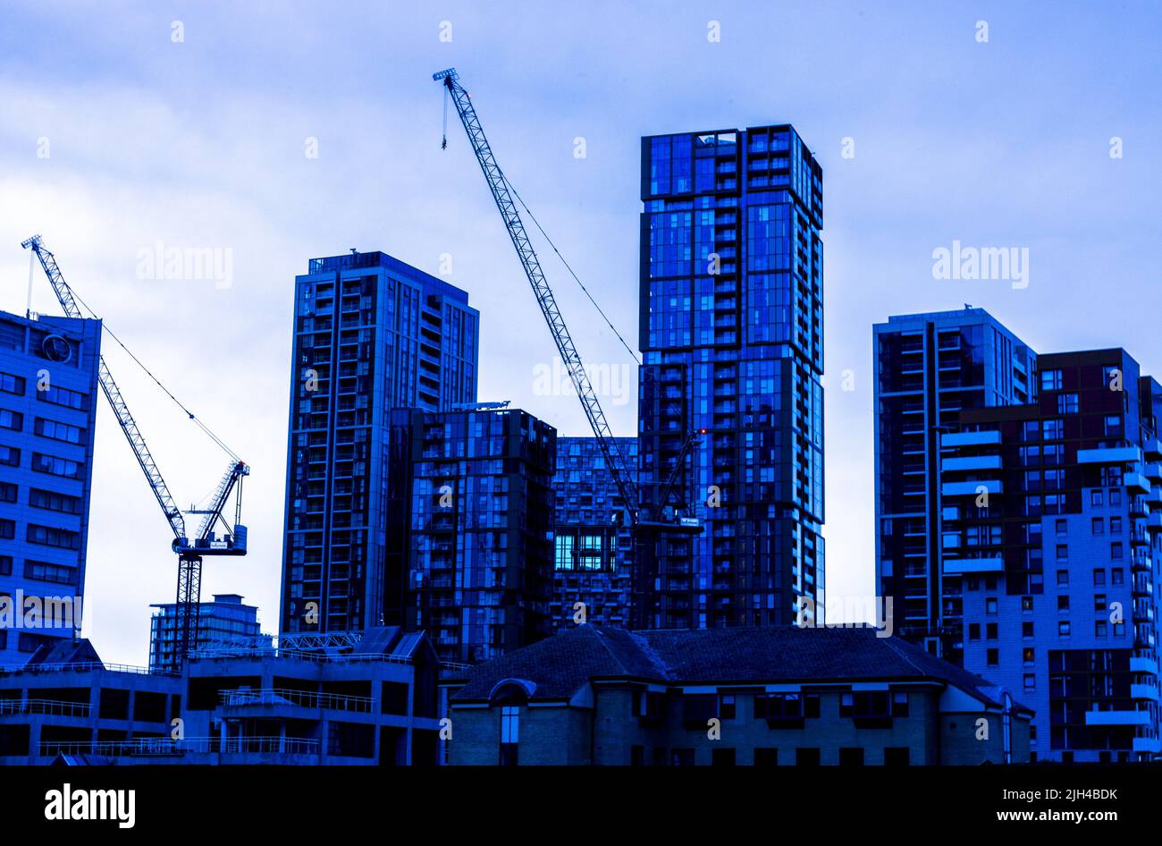 A ground perspective of some high rise buildings in the middle of a ...
