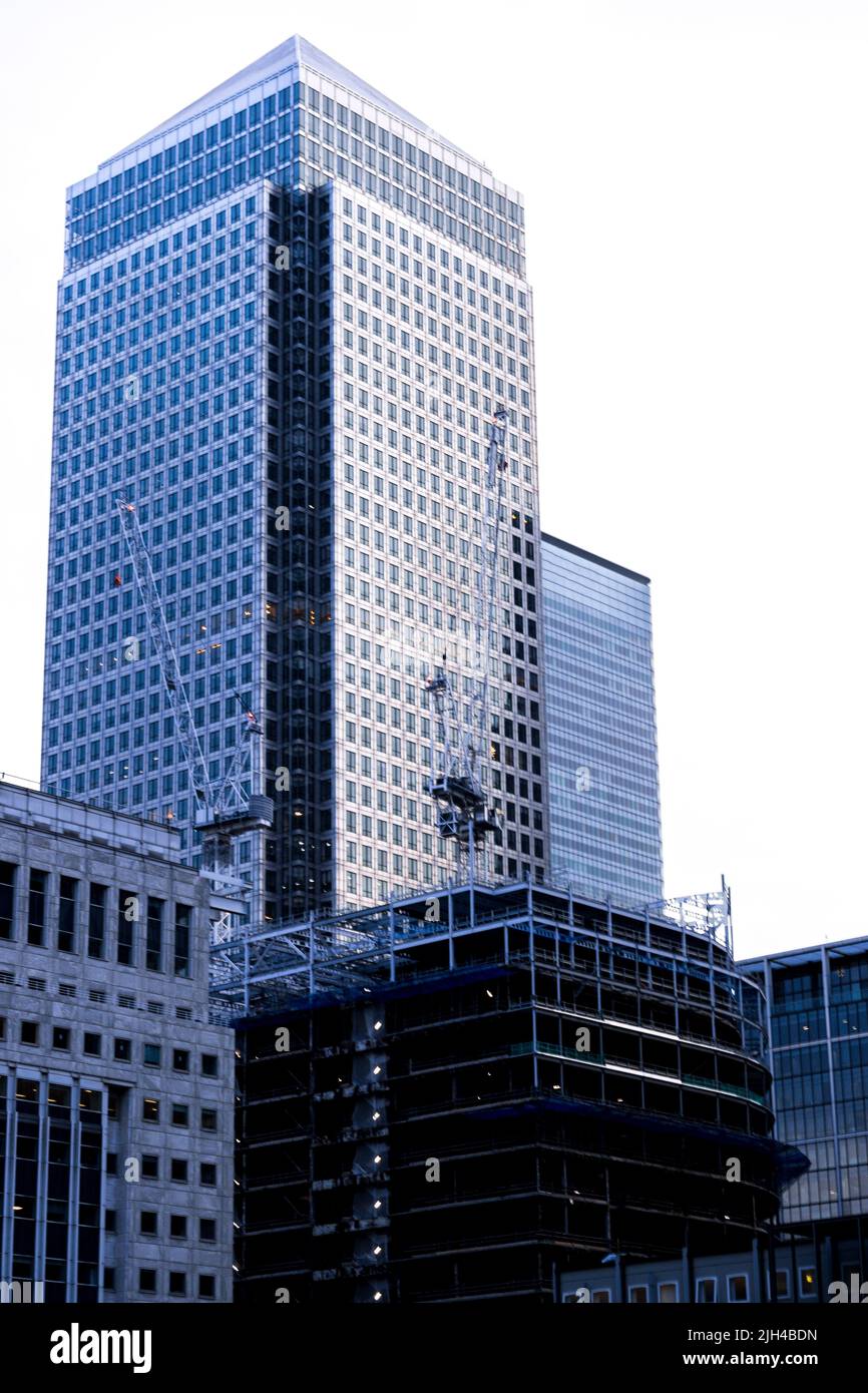 A ground perspective of some high rise buildings in the middle of a ...
