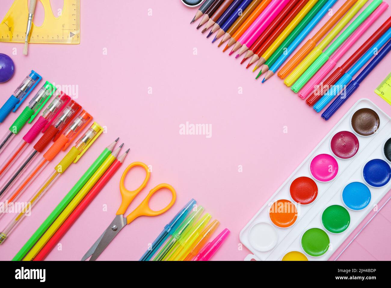 School supplies, colored pencils and watercolor paint pens, sticky ...