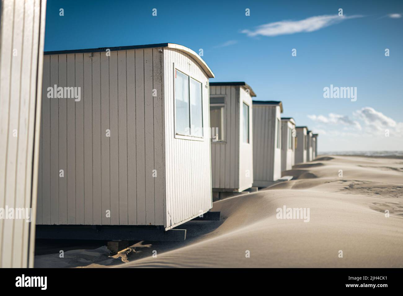 White beach huts at Lokken in Denmark. High quality photo Stock Photo ...