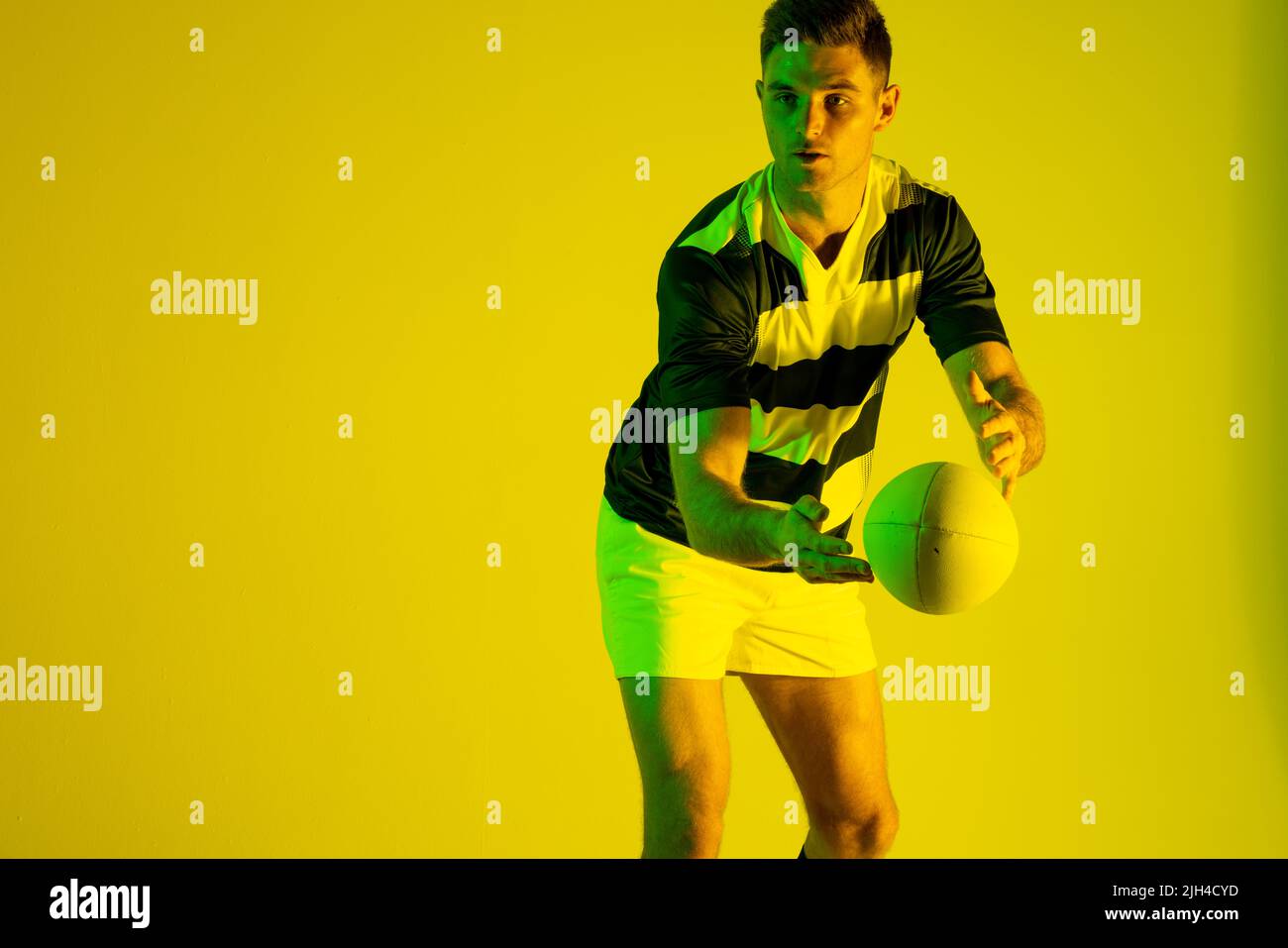 Caucasian male rugby player catching hi-res stock photography and ...