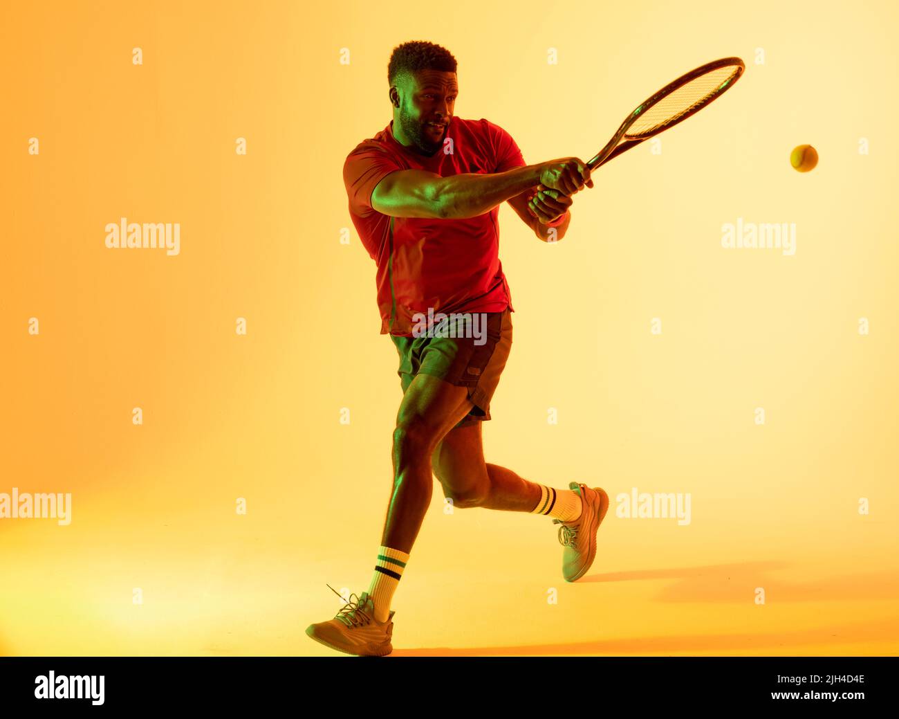Tennis player hitting ball african hi-res stock photography and images ...