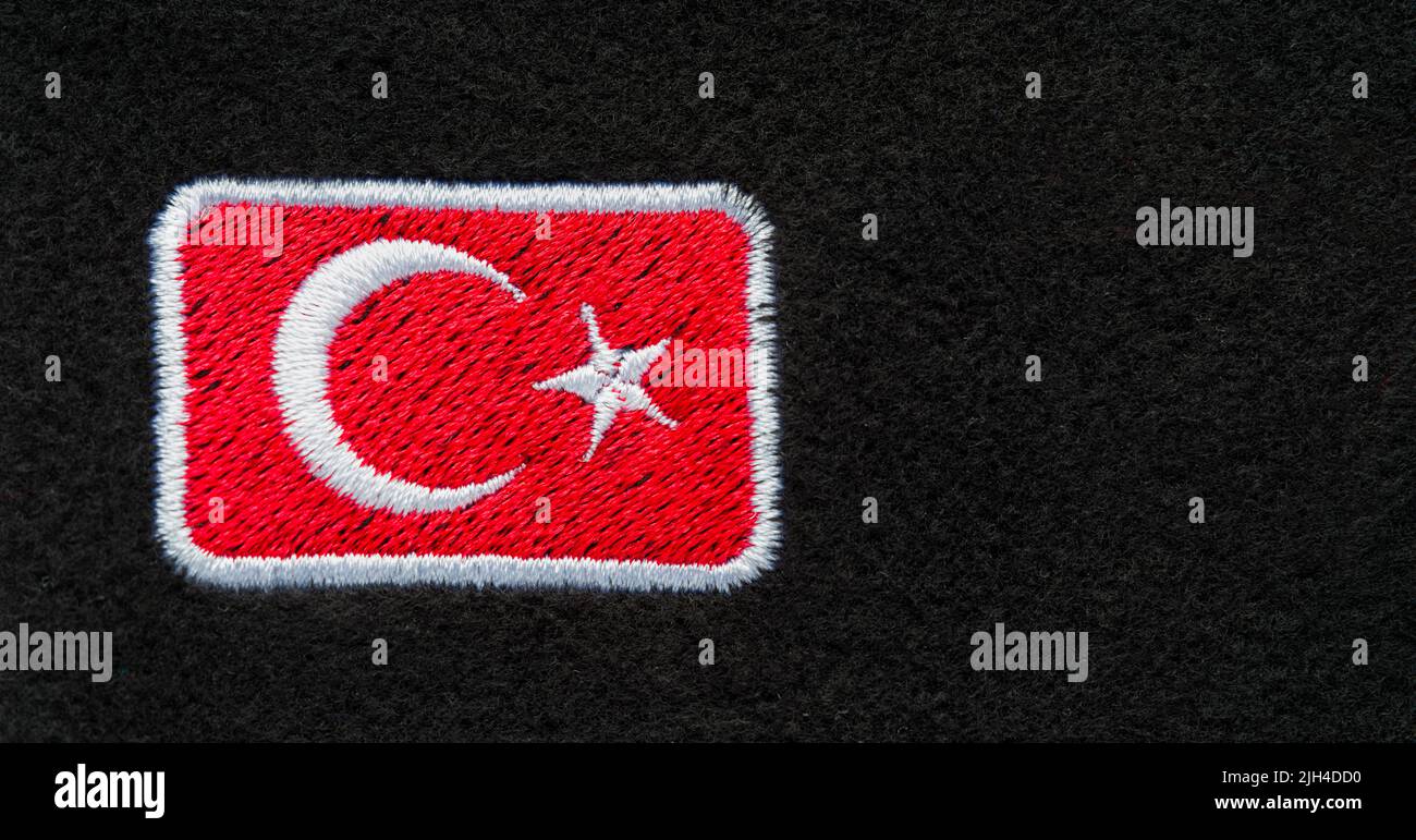 Turkish flag sewn on black fabric. Turkish state flag Stock Photo - Alamy