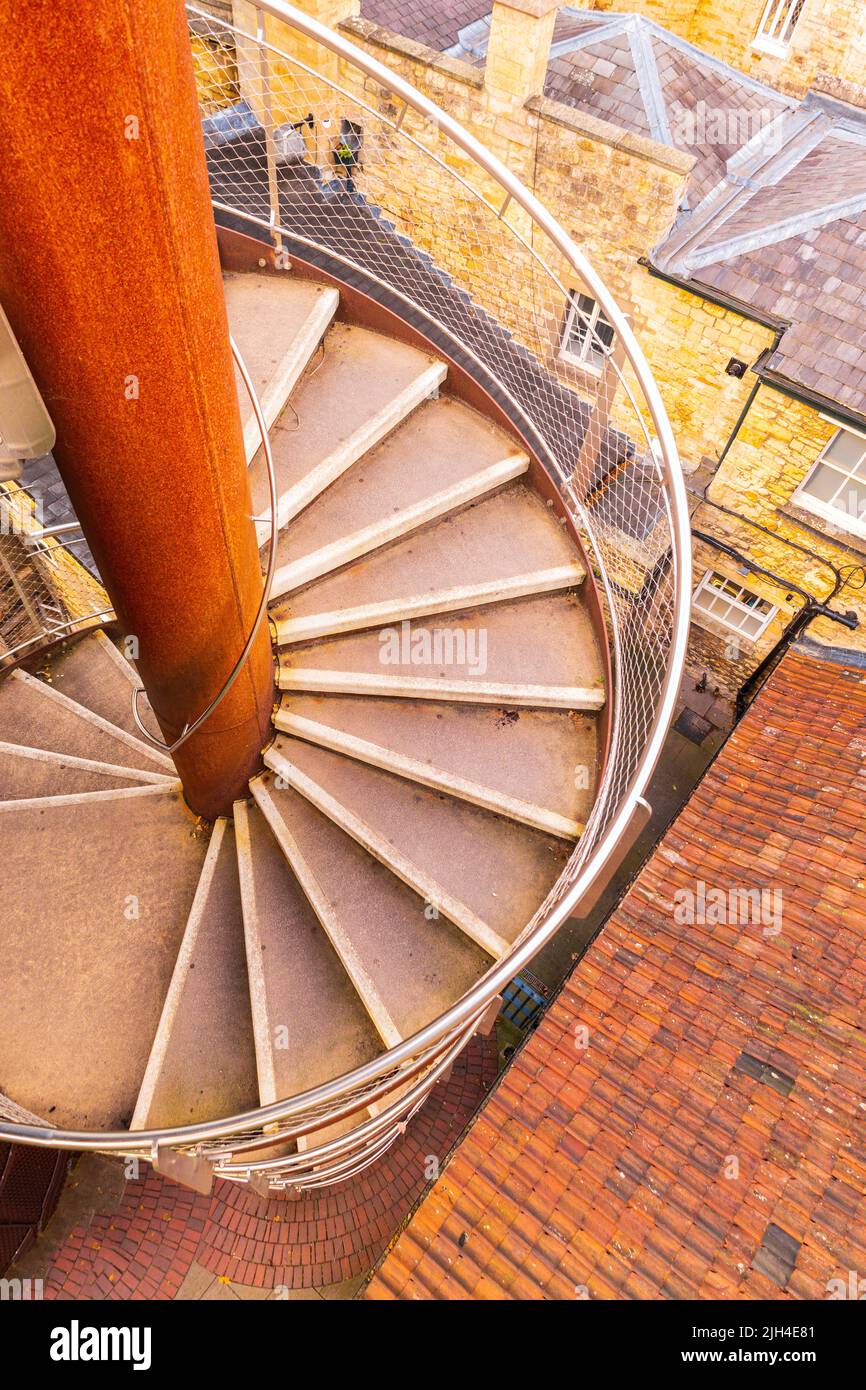 A giant, rusty, metal spiraling staircase. A clever structure allowing ...