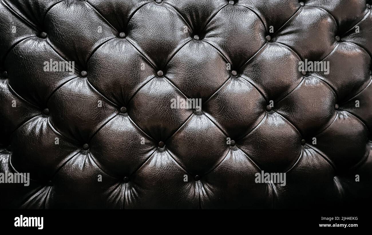 Vintage dark sofa texture background Stock Photo - Alamy