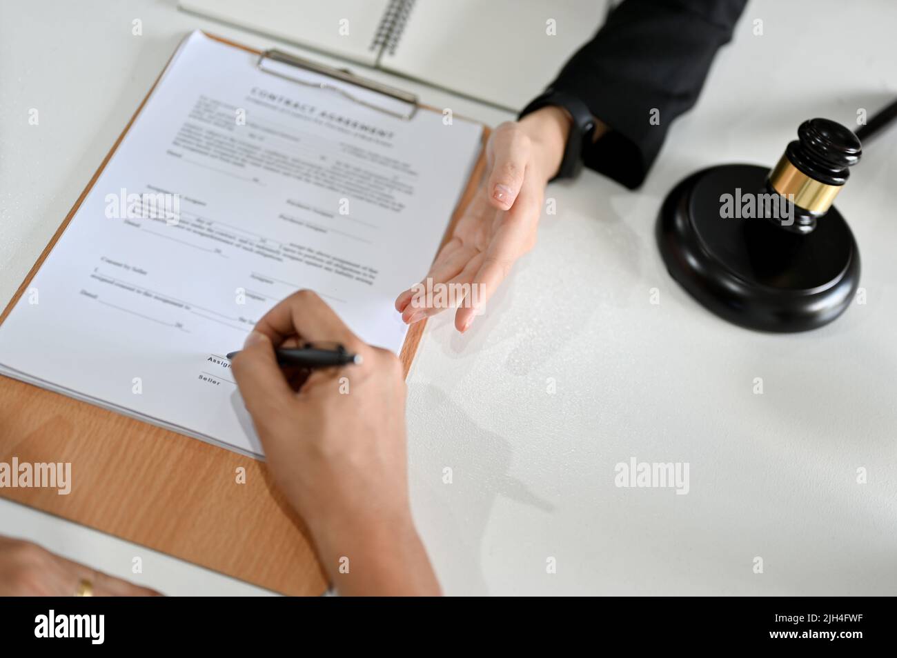 Top view, Businessman client sign his signature on a contract agreement ...