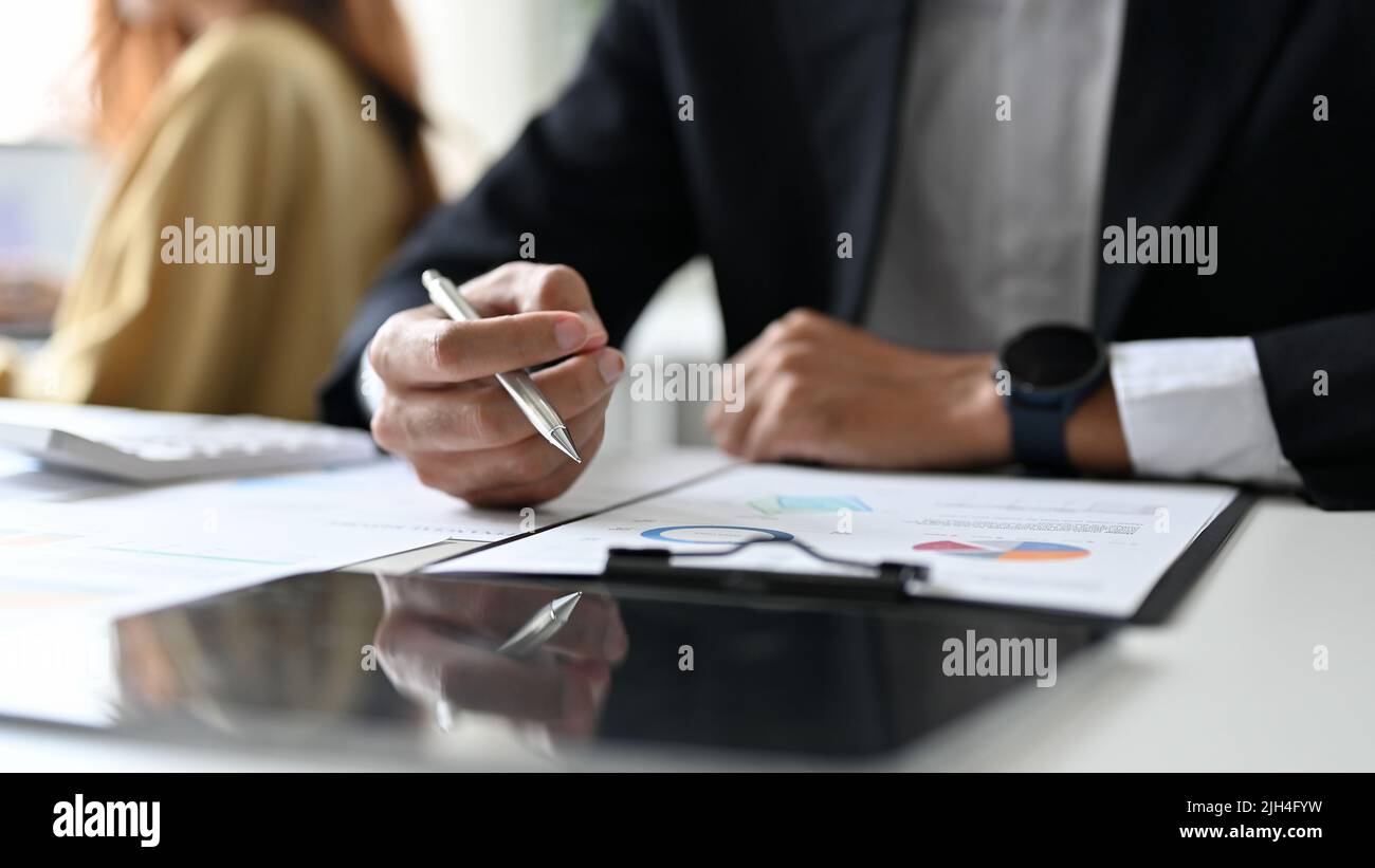 Businessman examine paperwork hi-res stock photography and images - Alamy