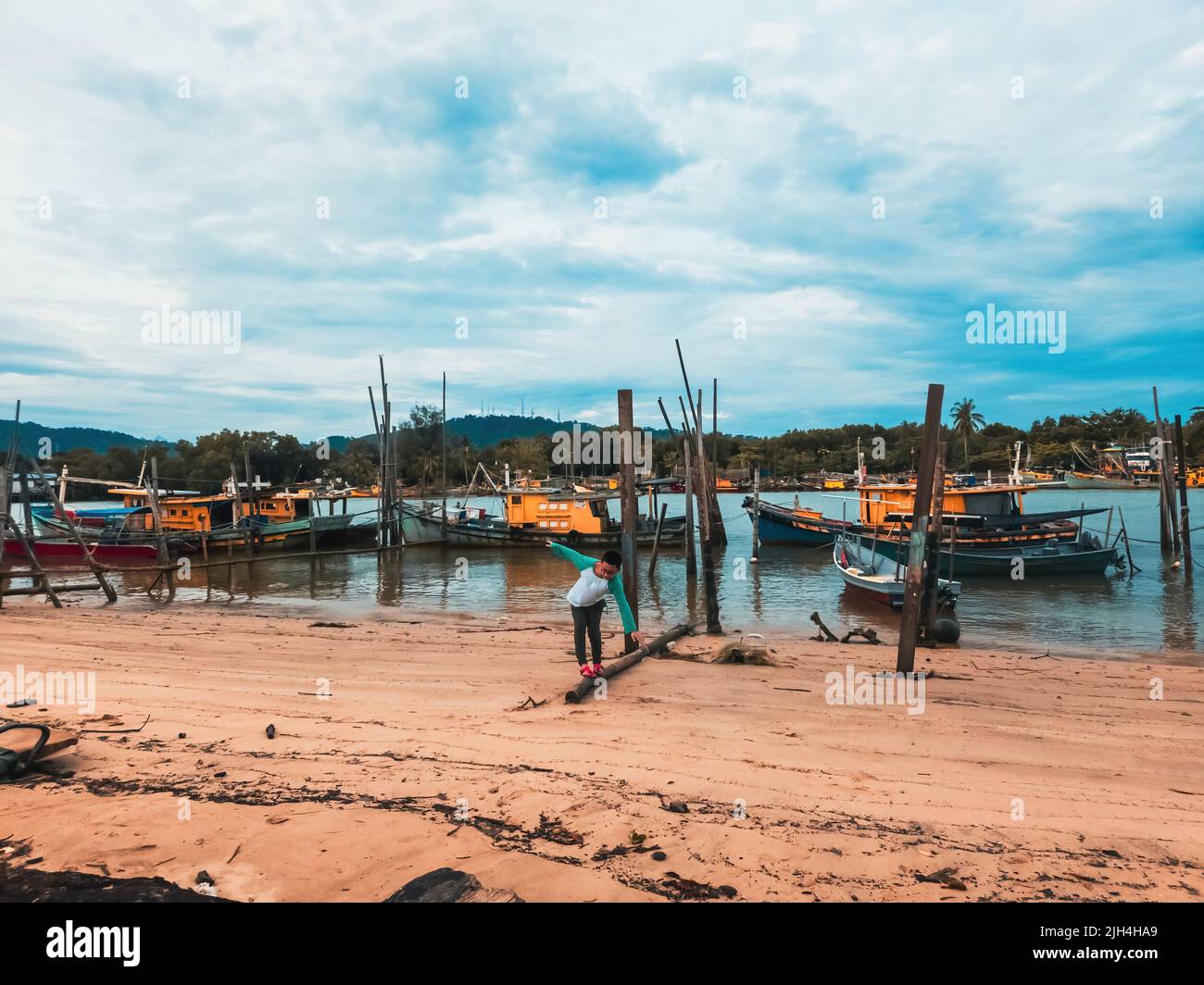 Sunset time at the fisherman village with full of boats Stock Photo - Alamy