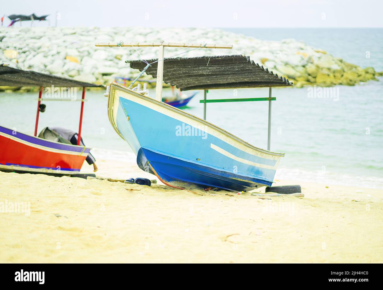 Fisherman boat on the ground at the beach Stock Photo - Alamy
