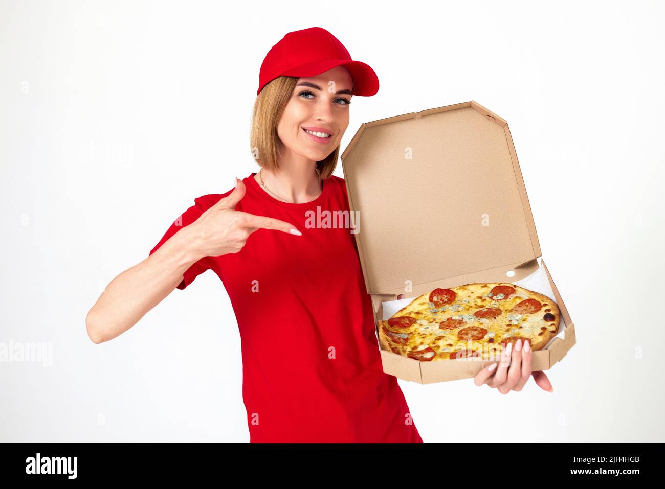 pizza delivery girl pointing finger to pizza on white background Stock ...