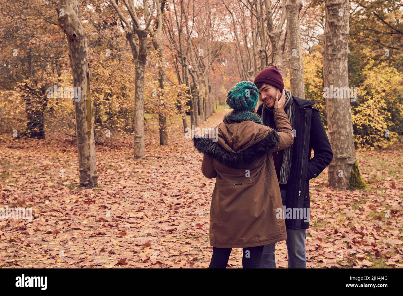 Caucasian white back girl in front of her boyfriend looking into each ...