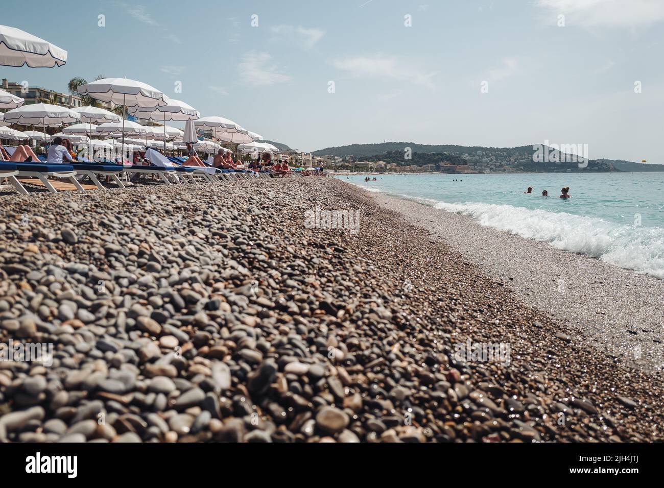Nice, France-June 2022: life by The beautiful stone beach Stock Photo ...