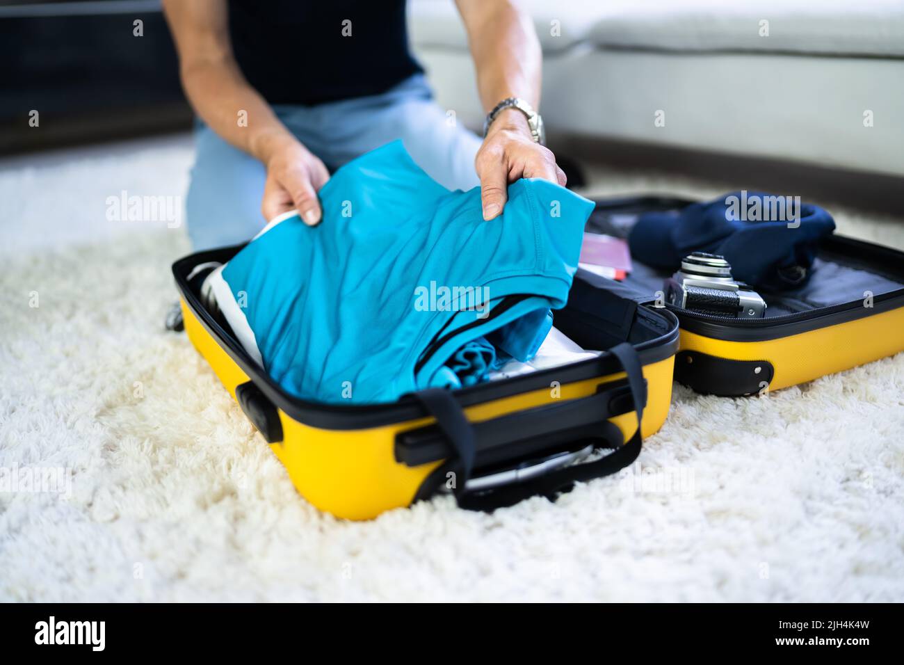 Suitcase Luggage Packing For Travel. Holiday Trip Stock Photo - Alamy