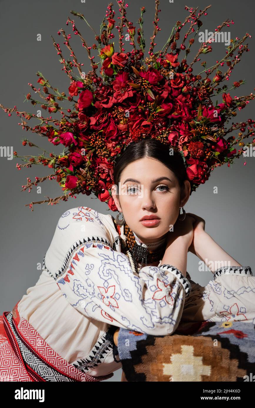 portrait of young ukrainian woman in traditional clothes and floral ...