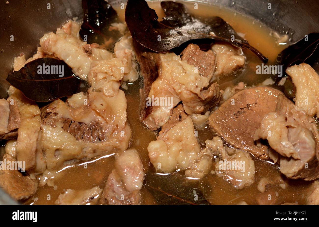 Pieces of chopped meat beefsteak cooked on hot steam with onion slices ...