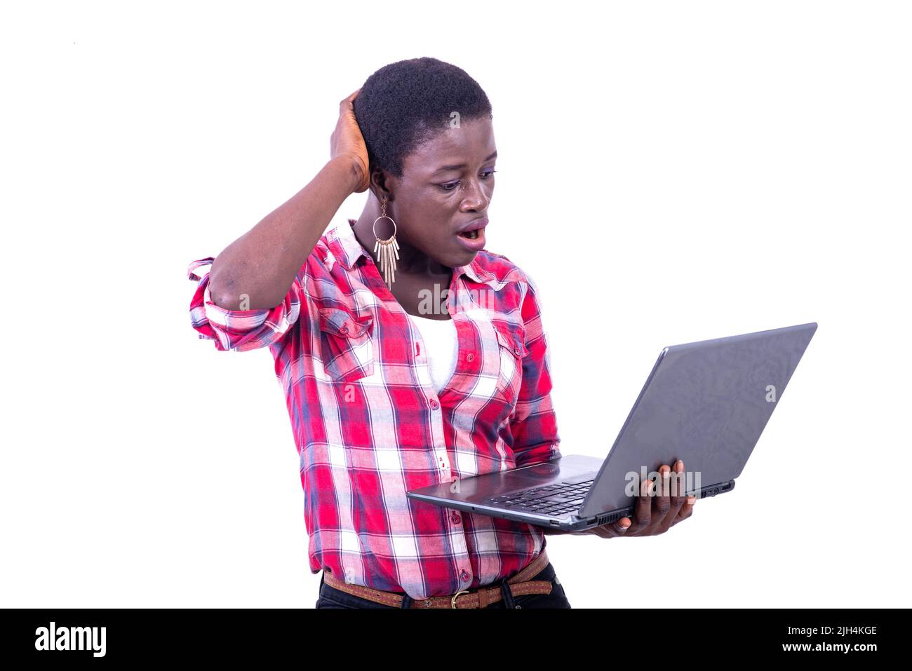 portrait of a beautiful shocked young woman standing looking at the ...