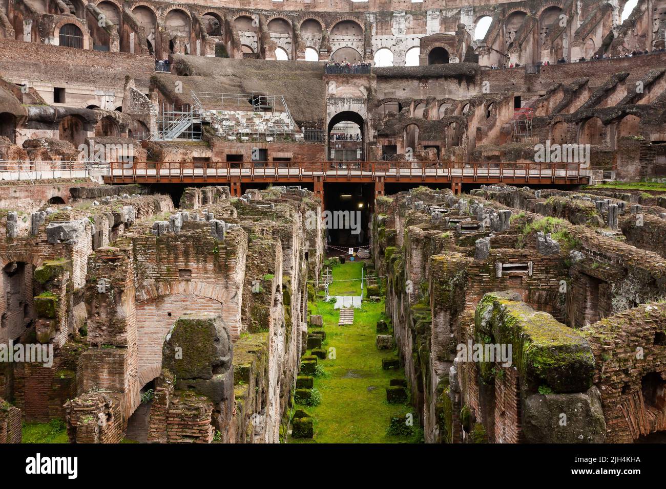Tourists walking among the ruins of the Roman Colosseum, Rome, Italy ...