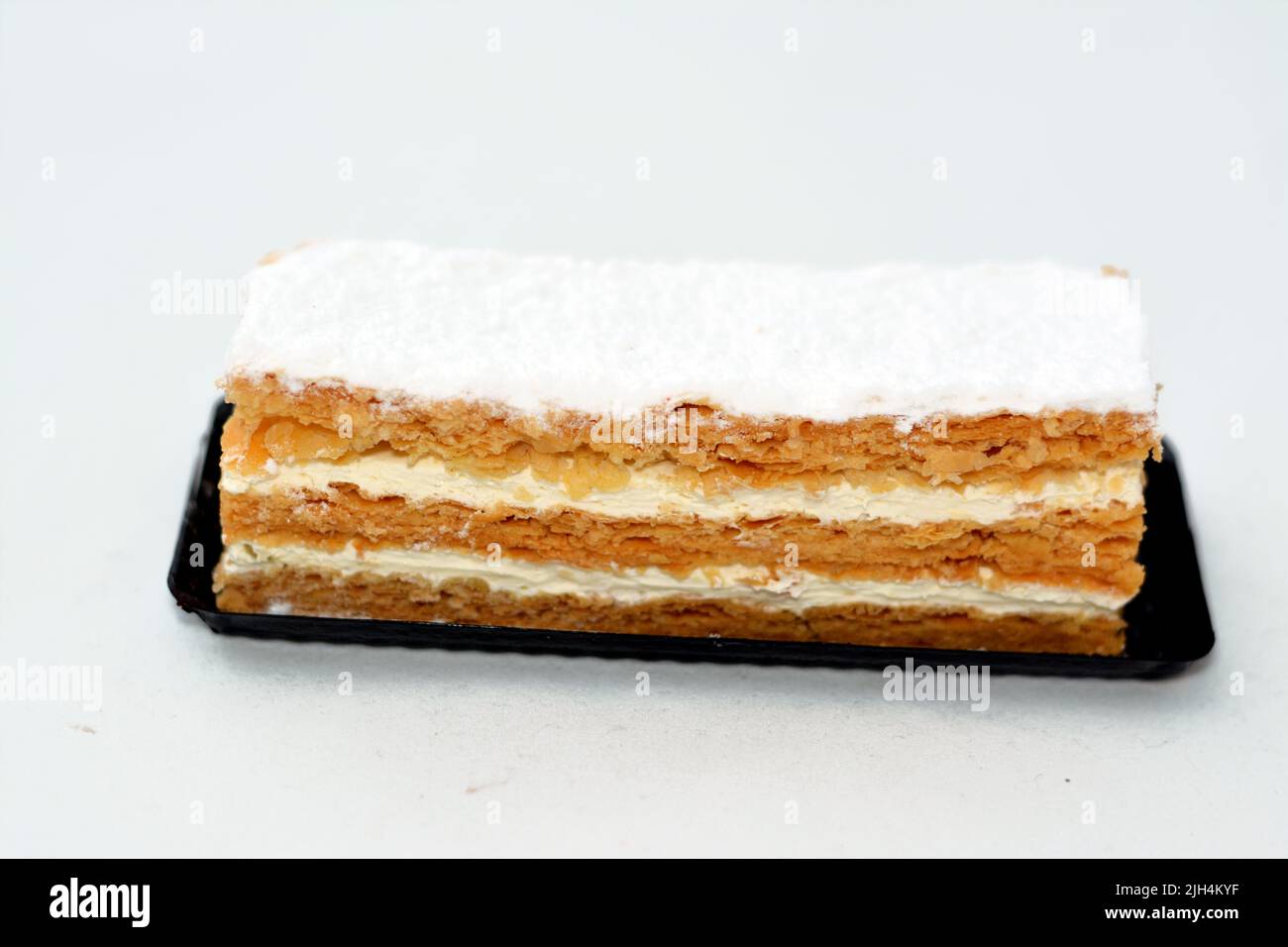 Classic powdered sugar Mille feuille cake gateau made of milk, egg ...