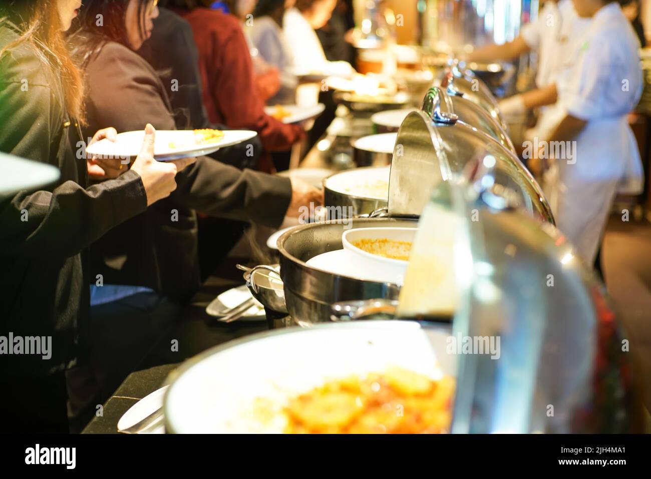People group grab buffet food in restaurant after seminar Stock Photo ...