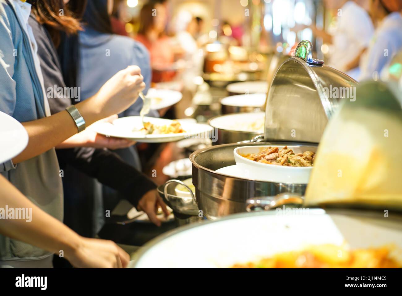 People group grab buffet food in restaurant after seminar Stock Photo ...